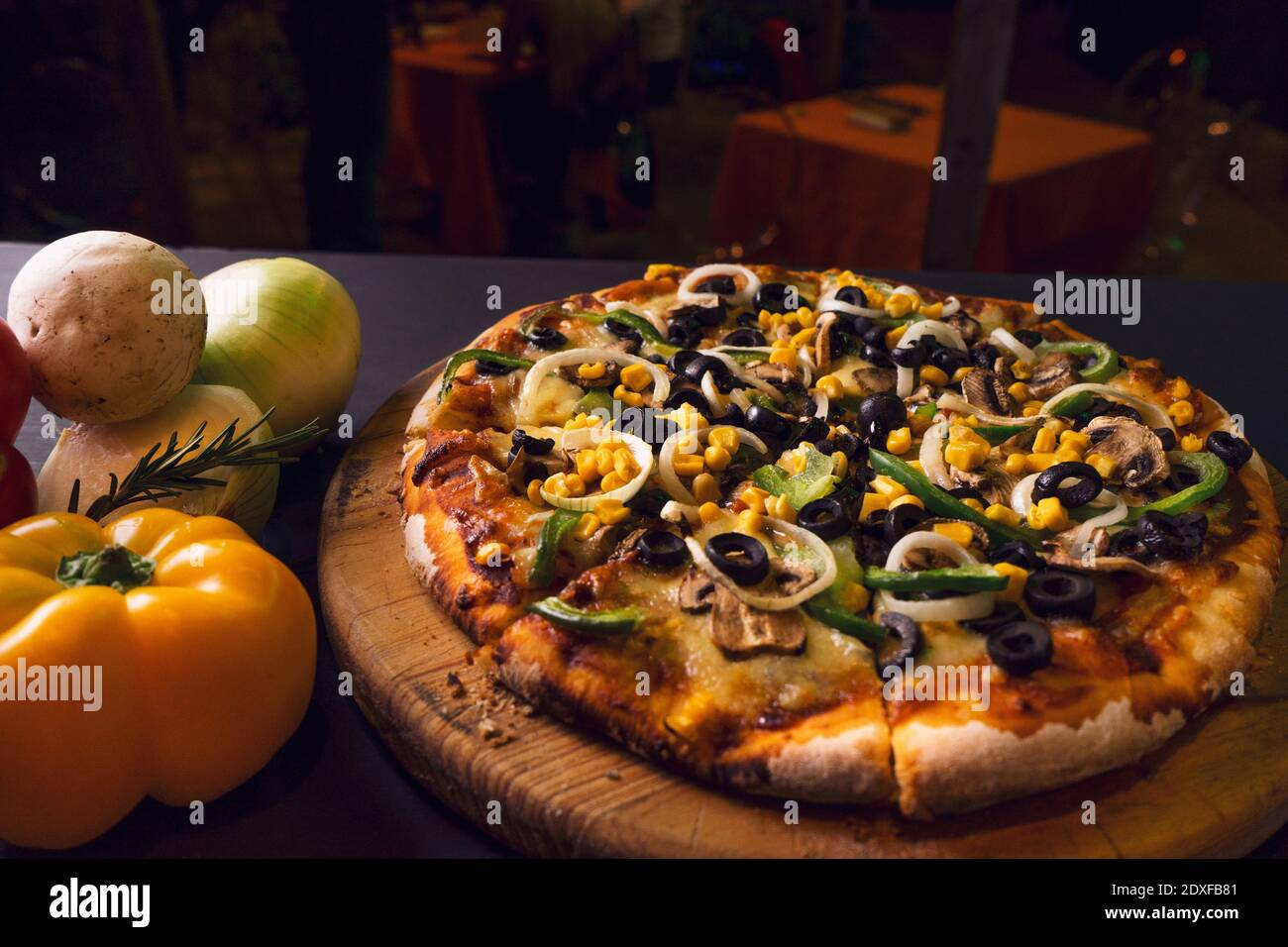 top view authentic Italian Pizza with black olives and vegetable rustic ...