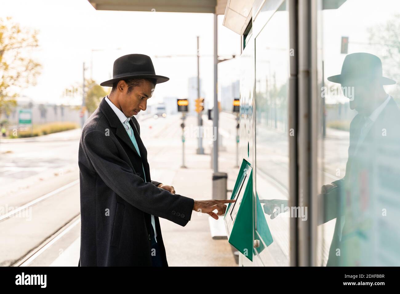 Person using ticket machine hi-res stock photography and images - Alamy