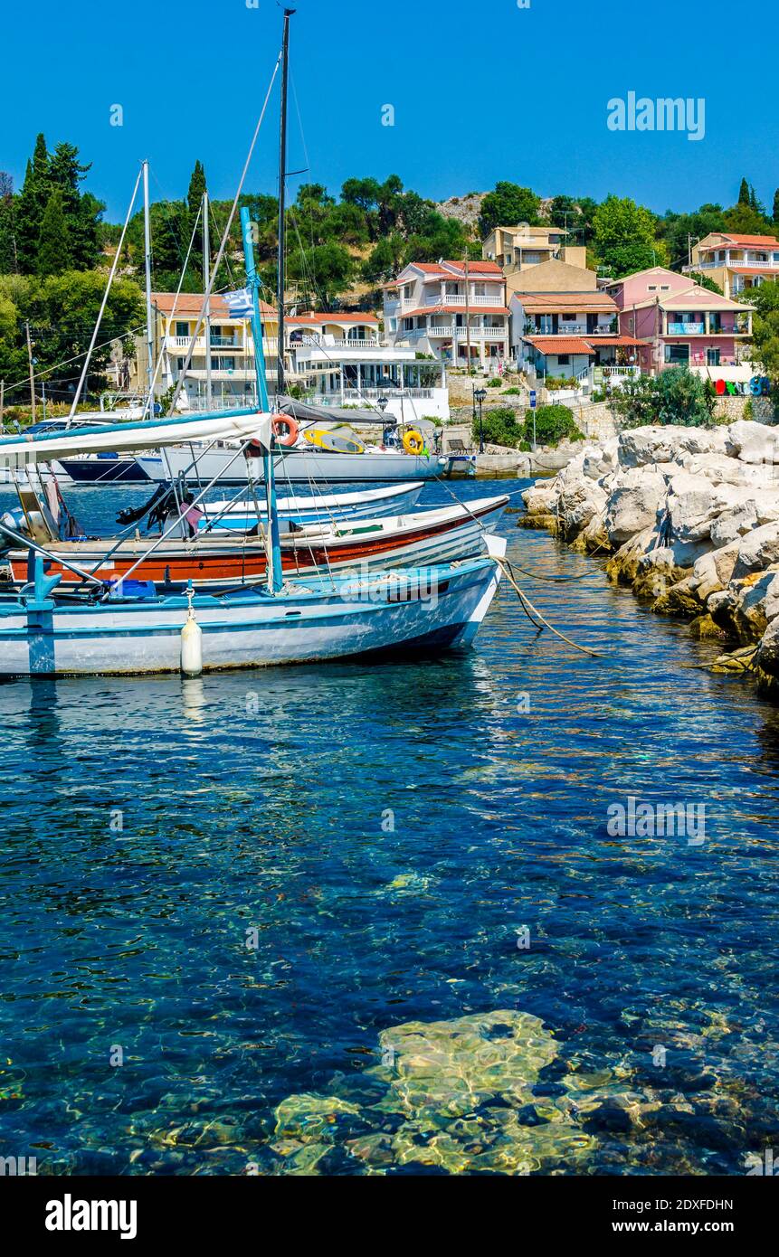 Fishing boats in the harbor at Kassiopi, Corfu, Greece Stock Photo - Alamy