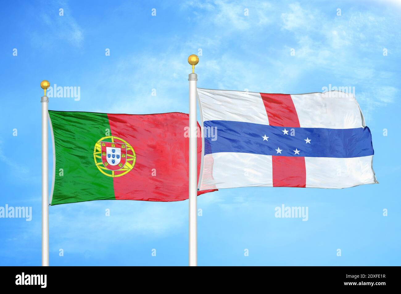 Portugal and Netherlands Antilles two flags on flagpoles and blue sky ...