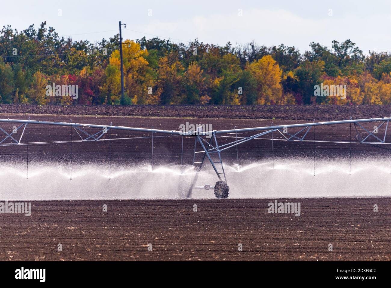 Modern irrigation system watering a farm field Stock Photo - Alamy