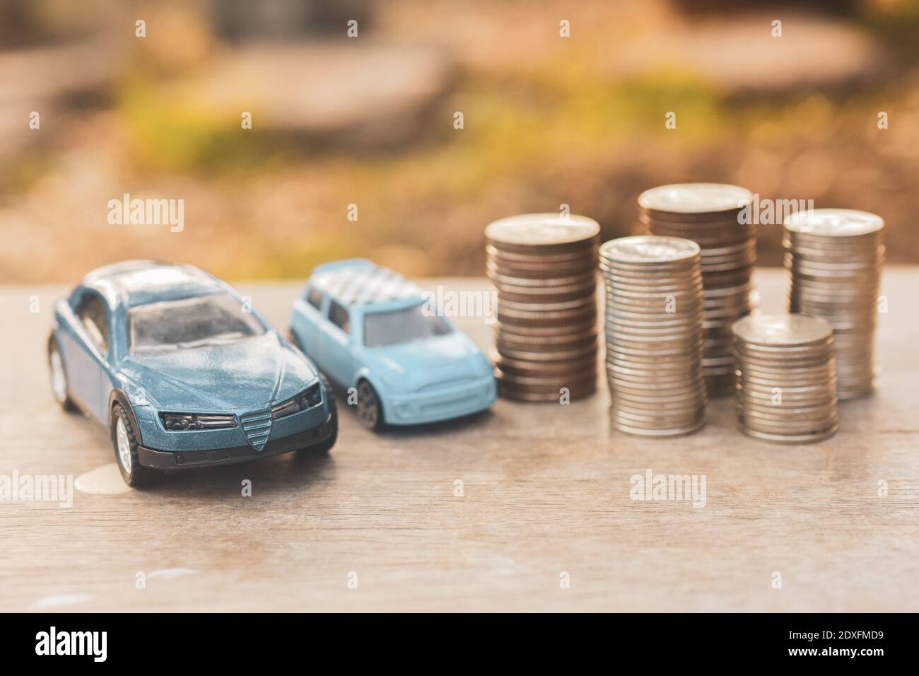 Cars Model coins stack on wooden table Finance insurance and ...