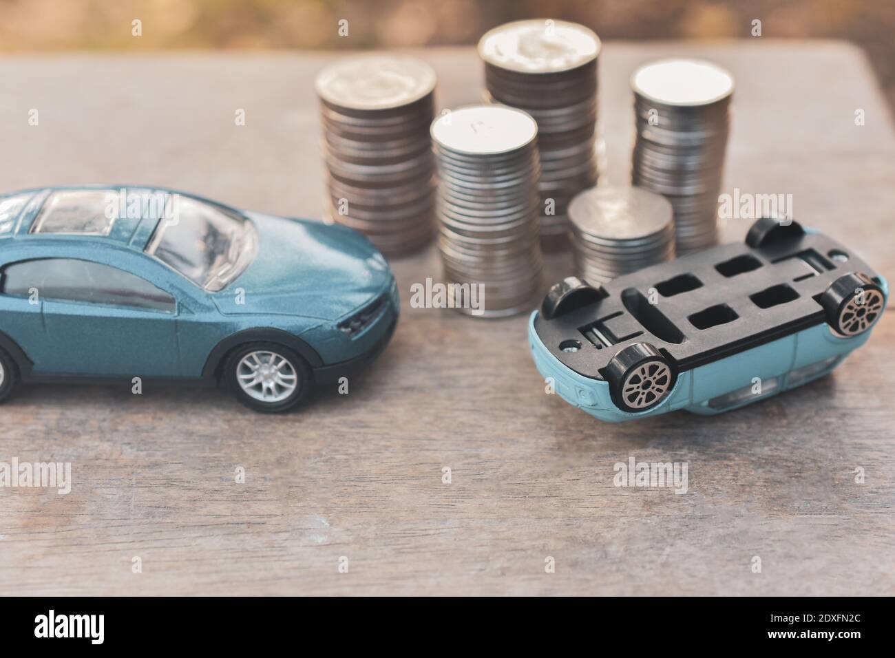 Cars Model coins stack on wooden table Finance insurance and ...
