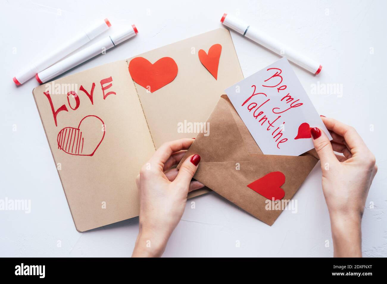 wrap your card in an envelope valentine's day Stock Photo - Alamy