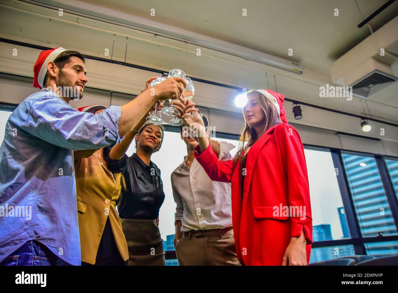 Friend group celebrate night party in office after work Merry Christmas ...