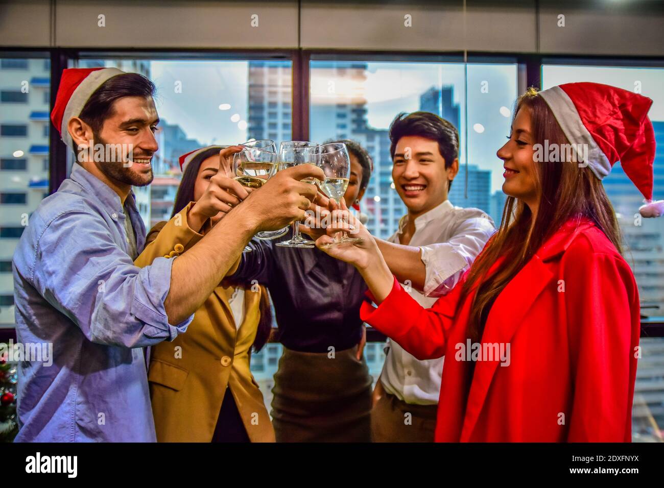 Friend group celebrate night party in office after work Merry Christmas ...