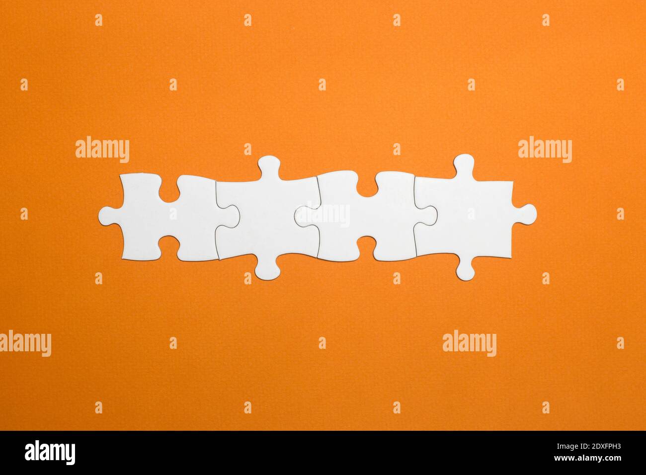 A 4 puzzle pieces joined together to form words or concepts that ...