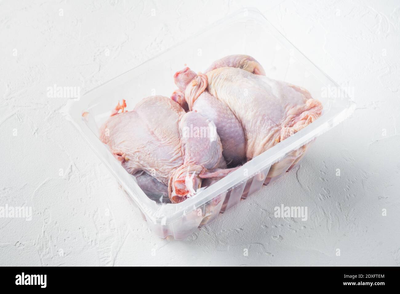 Raw chicken set in plastic vacuum tray, on white background Stock Photo ...