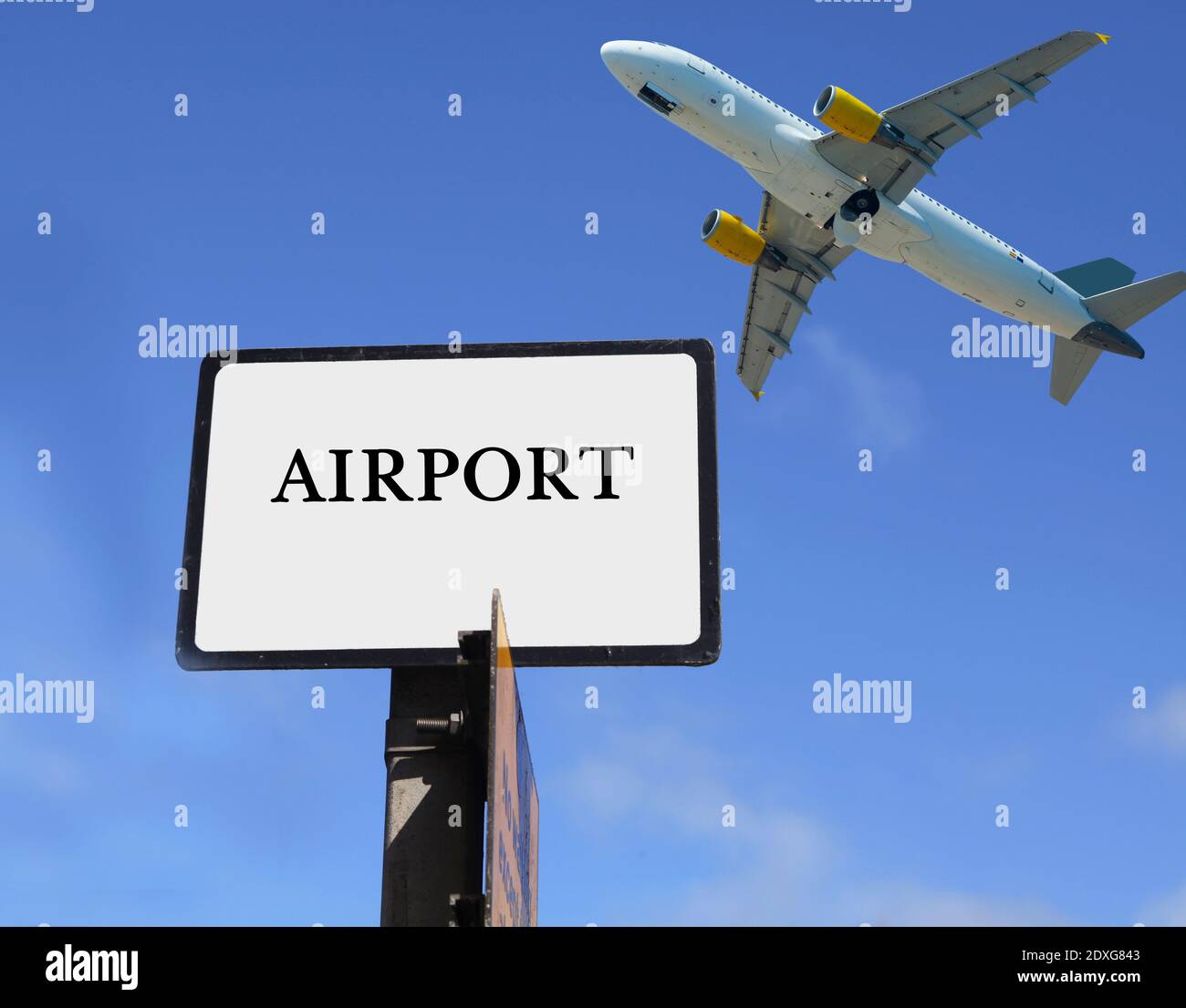 Airplane flying upwards into a blue sky with airport sign Stock Photo ...