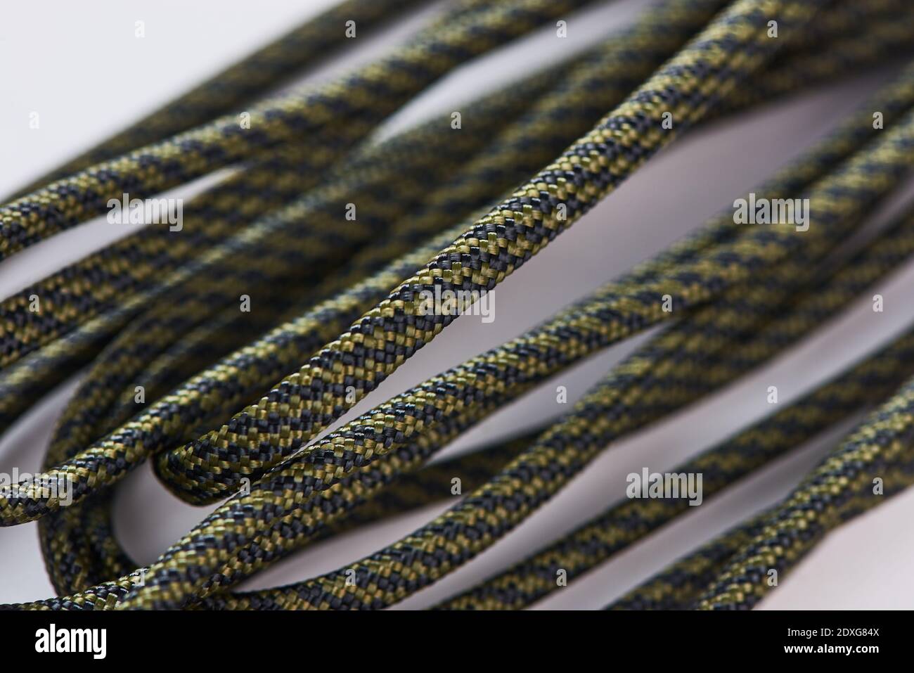 Close-up on black and green paracord on white background Stock Photo ...