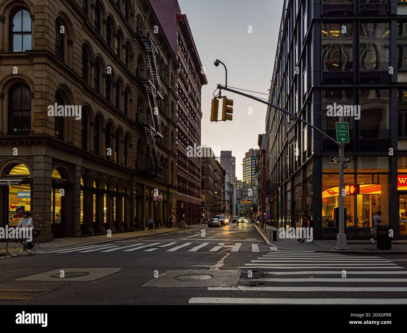 Street view at intersection in SoHo, Manhattan, New York City at sunset ...