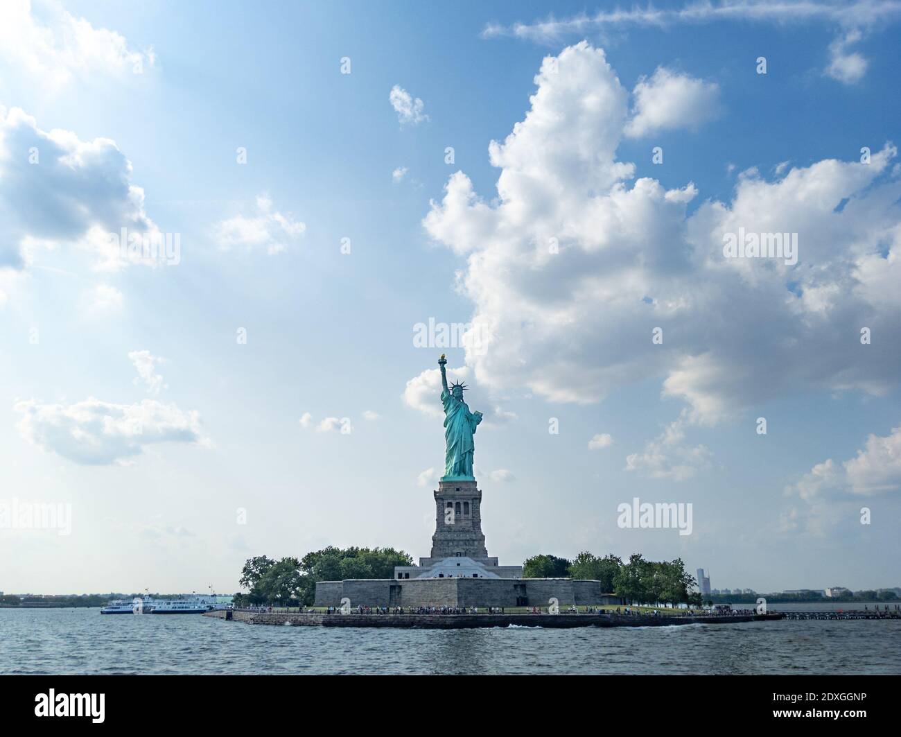 Statue of Liberty in Liberty Island, New York on sunny day Stock Photo ...