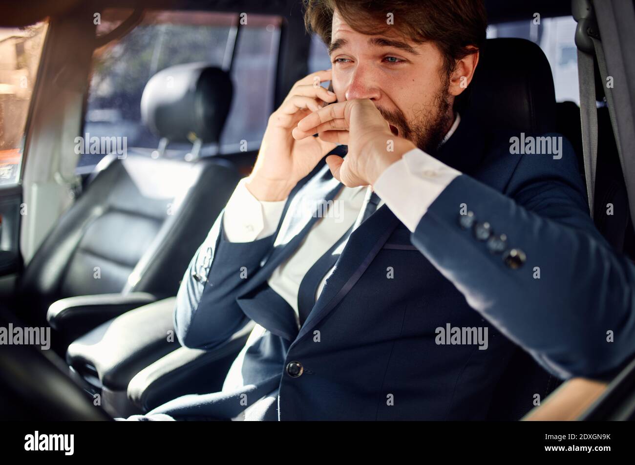 successful young man in suit talking on the phone wealth official Stock ...