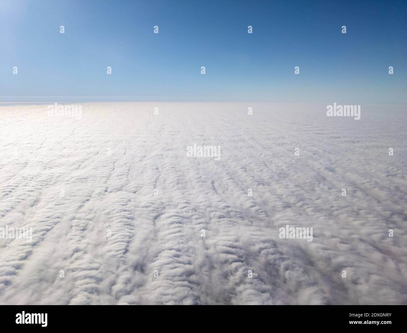 Aerial view above layer of altocumulus clouds with unique texture at midday Stock Photo - Alamy