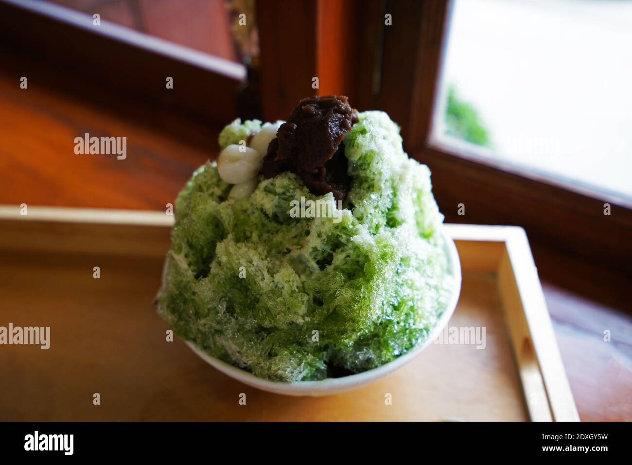 Close up Matcha green tea Kakigori topped with mochi and mashed red ...