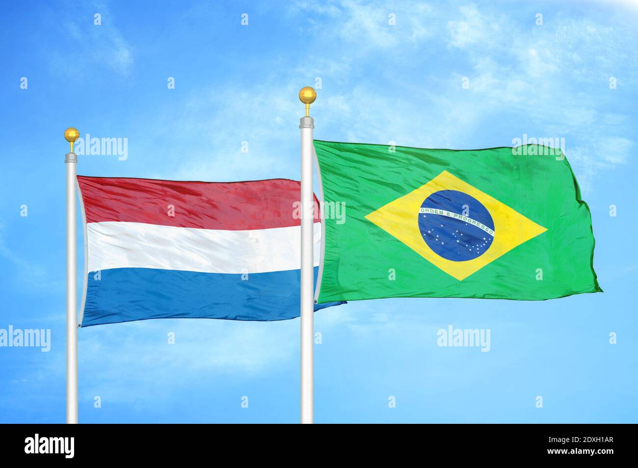 Netherlands and Brazil two flags on flagpoles and blue sky Stock Photo ...