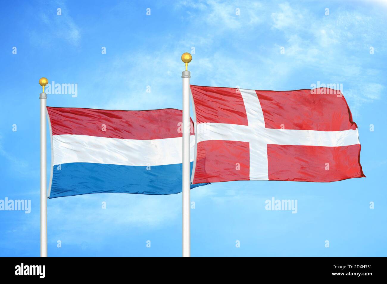 Netherlands and Denmark two flags on flagpoles and blue sky Stock Photo ...