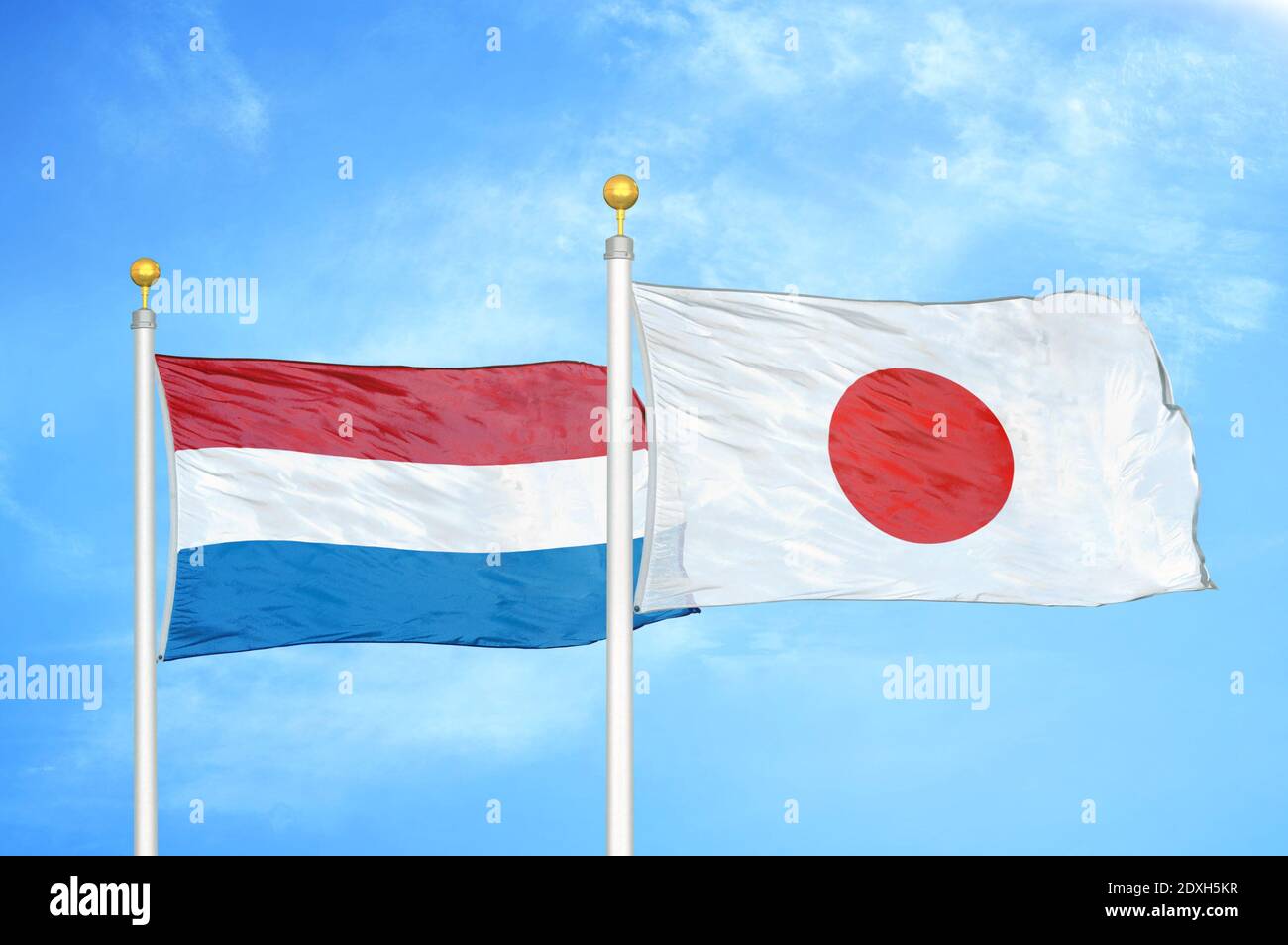 Netherlands and Japan two flags on flagpoles and blue sky Stock Photo ...