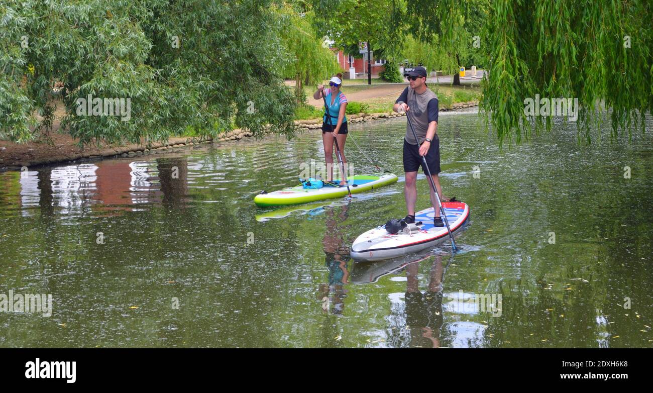Young couple paddle boarding on the river Ouse at Bedford Stock Photo ...