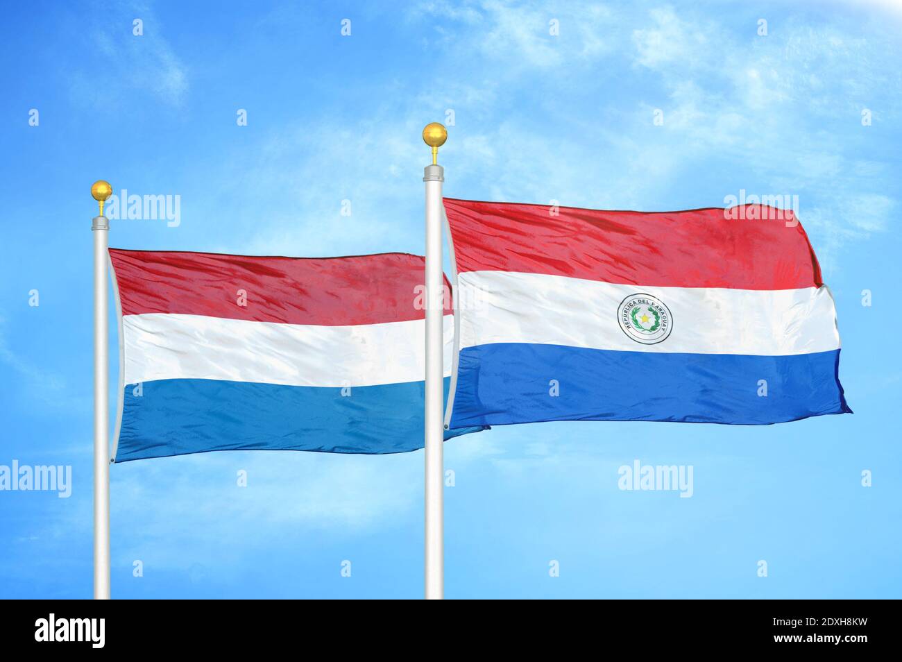 Netherlands and Paraguay two flags on flagpoles and blue sky Stock ...