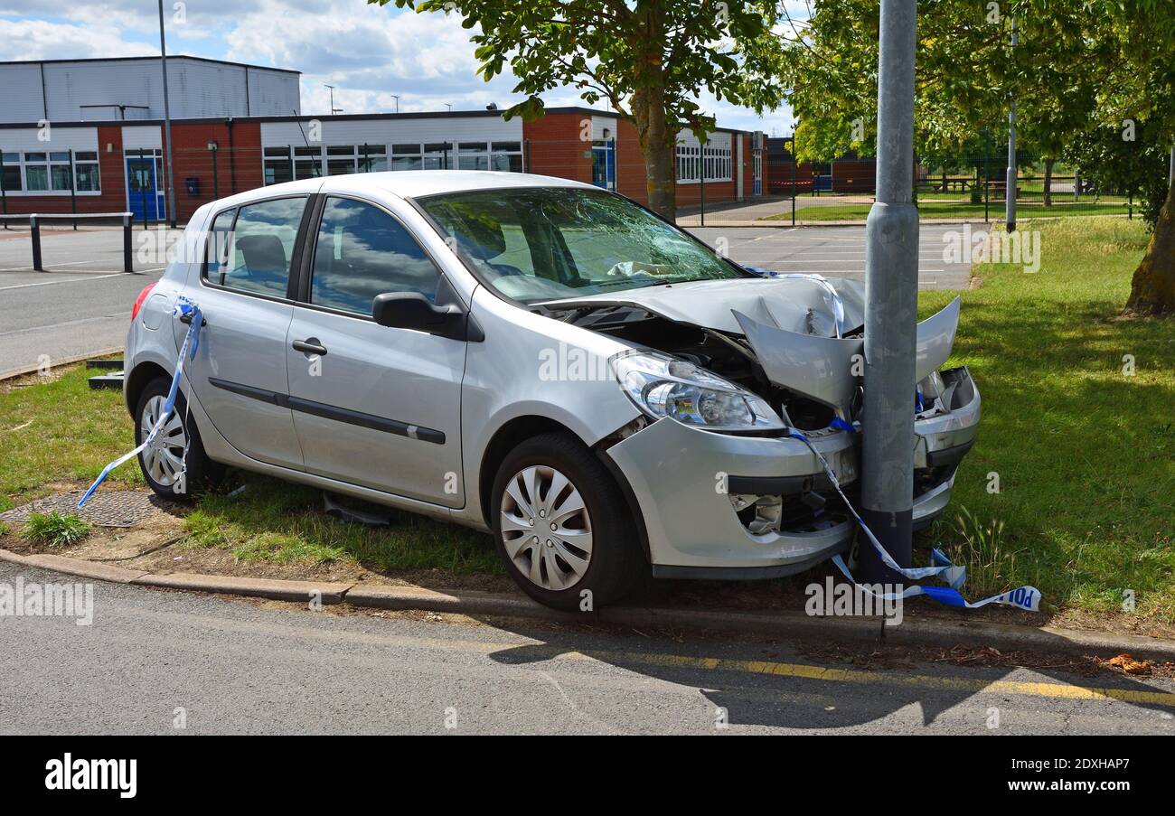 Car crashed into lamp post near car park exit Stock Photo - Alamy