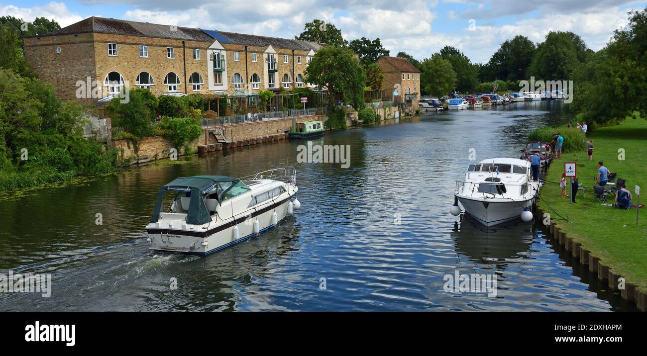 The rive Ouse at St Neots with river cruisers and waterside properties ...