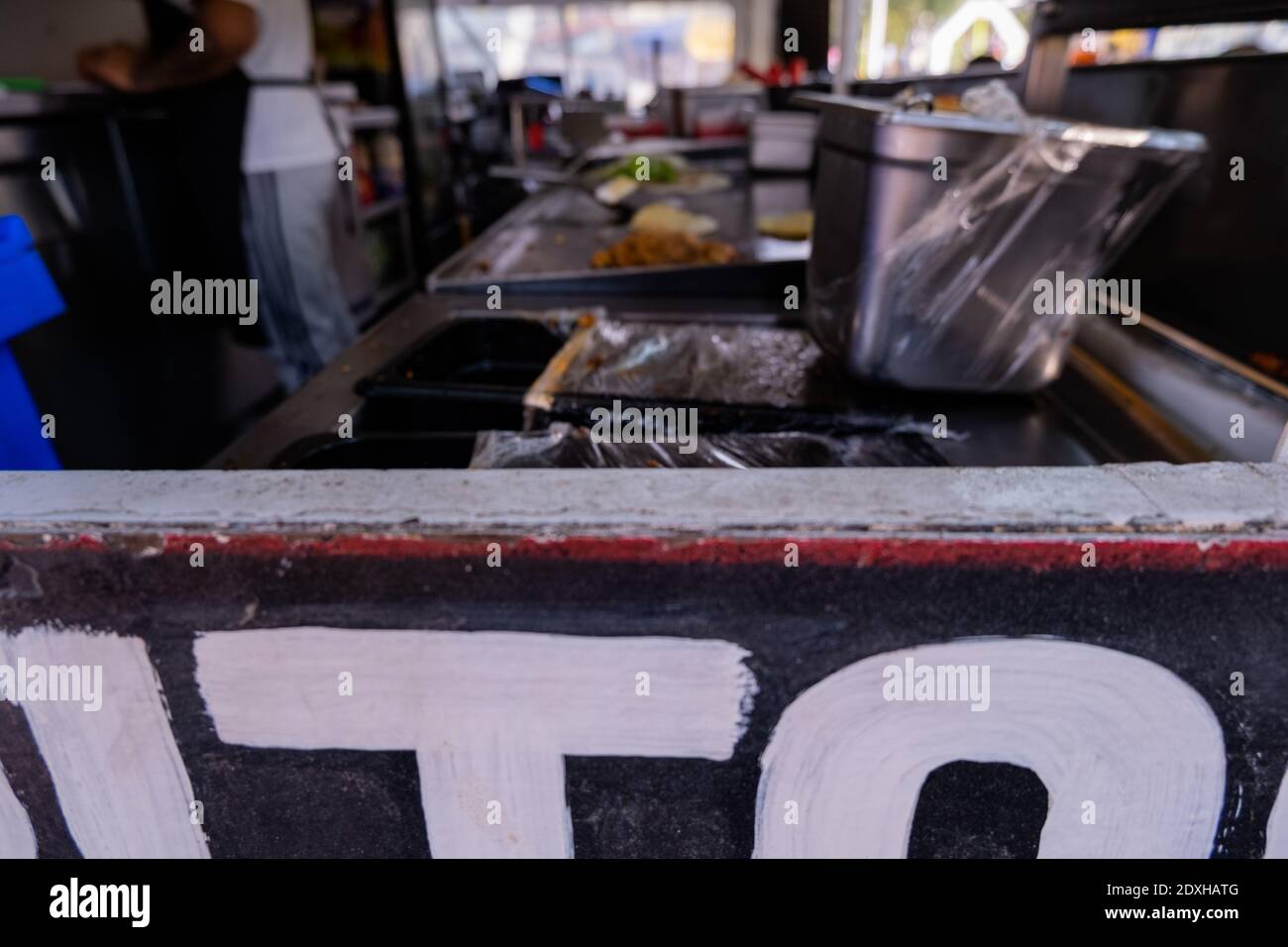 Cook preparing vegetarian meal inside a food truck Stock Photo - Alamy