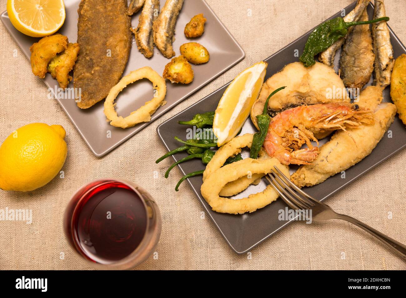top view of dishes with golden fried fish and wine Stock Photo - Alamy