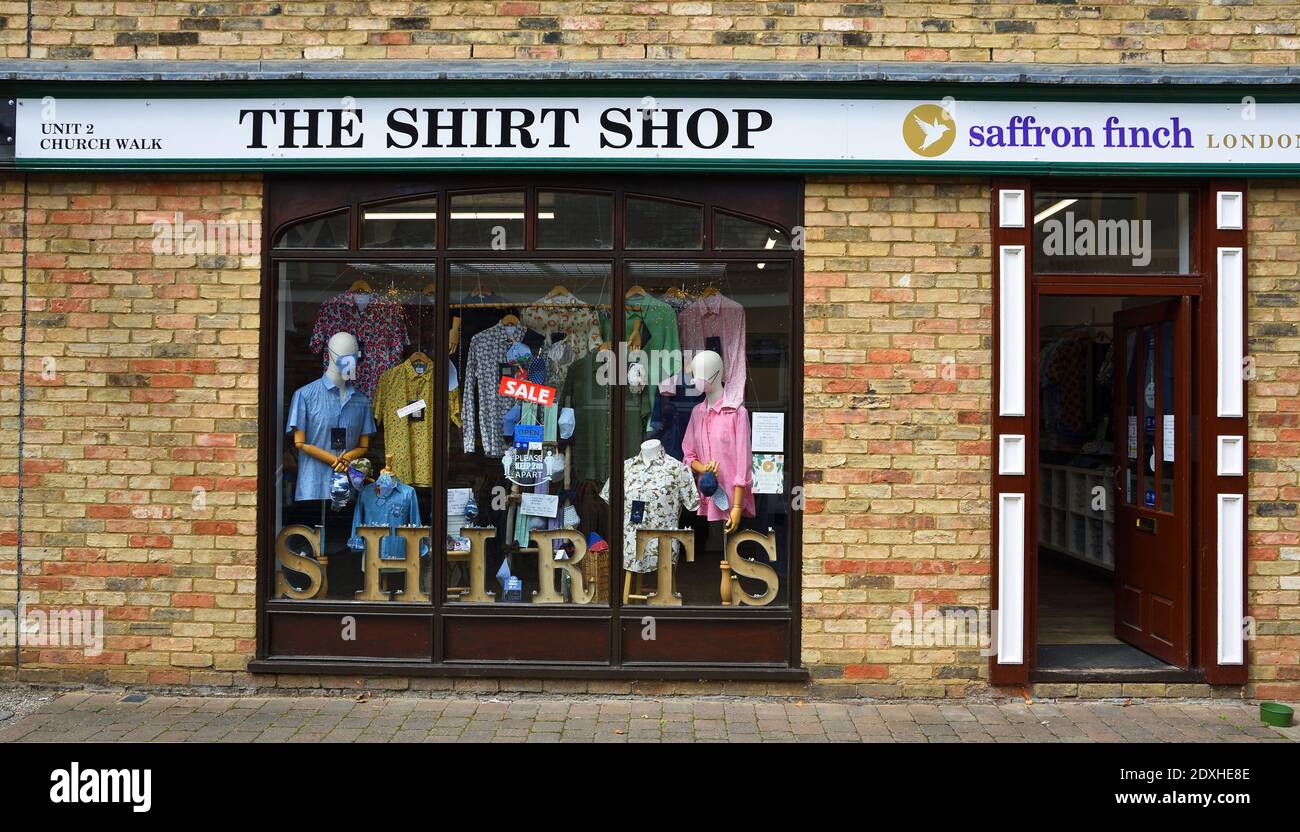 Shirt shop window with colourful window display Stock Photo - Alamy