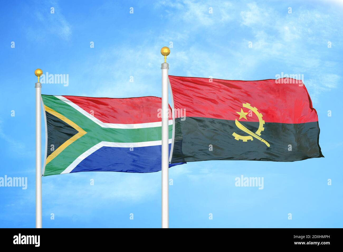 South Africa and Angola two flags on flagpoles and blue sky Stock Photo ...