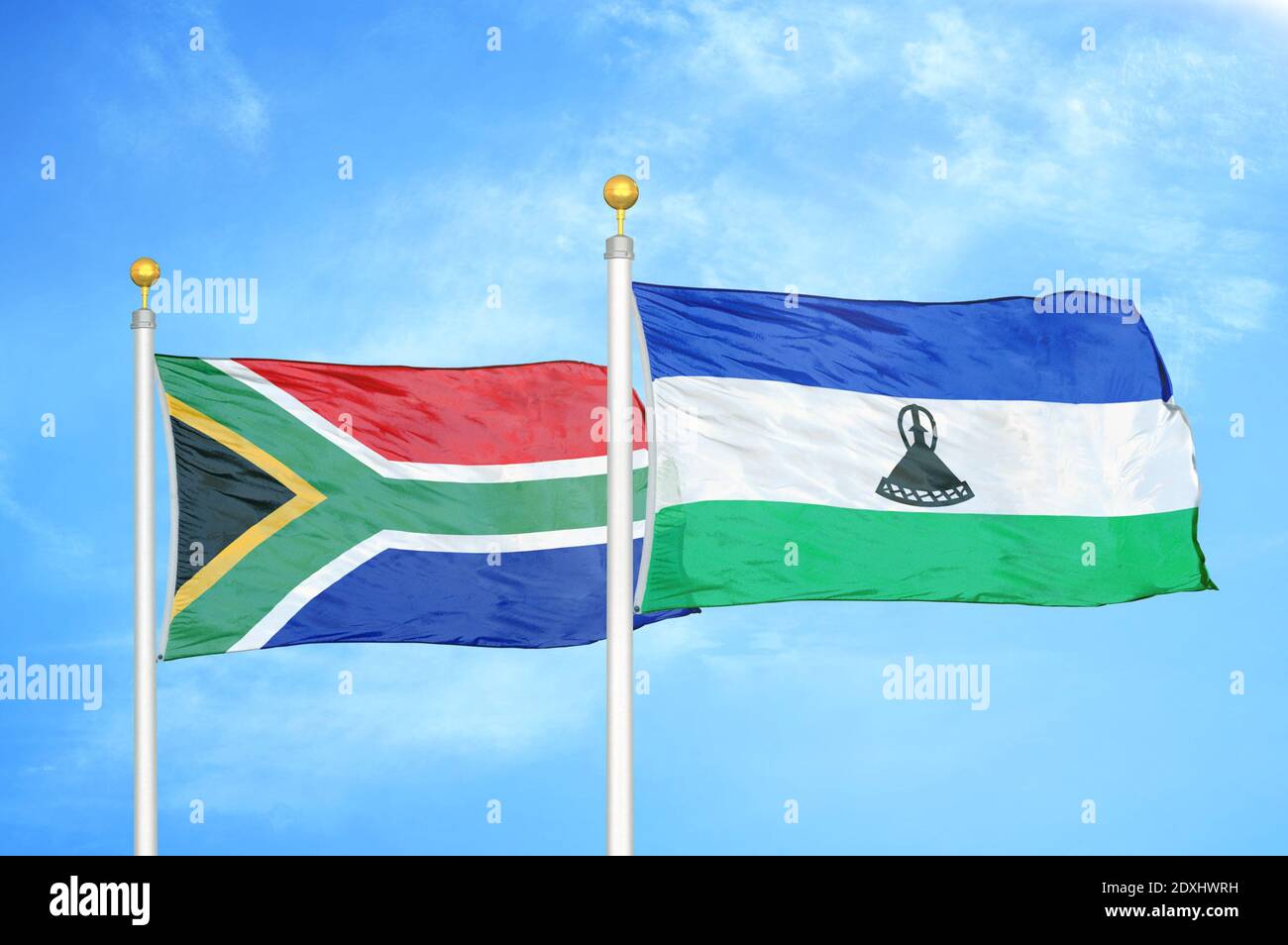 South Africa and Lesotho two flags on flagpoles and blue sky Stock ...