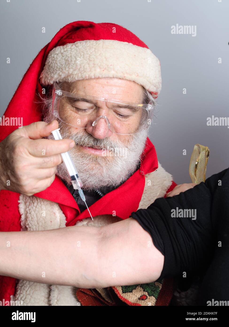 Santa Claus is ready to deliver vaccination to humanity Stock Photo - Alamy
