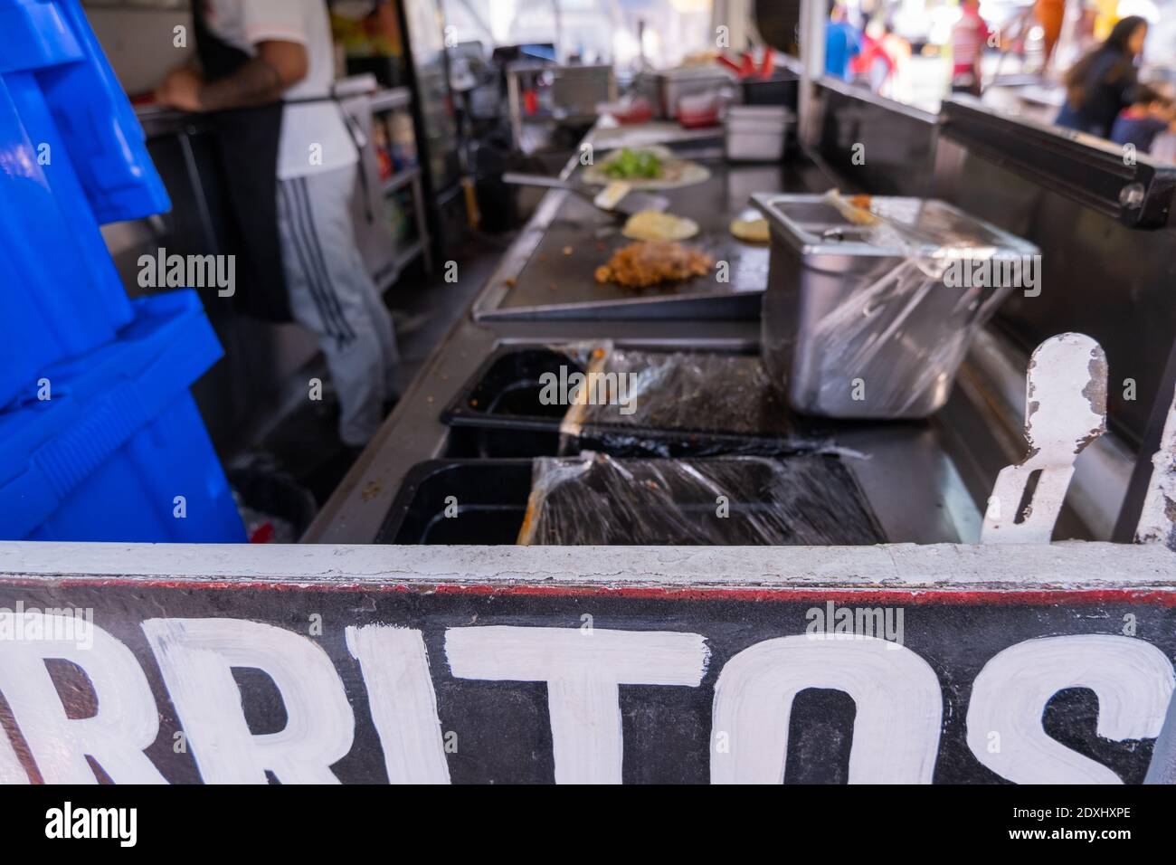 Cook preparing vegetarian meal inside a food truck Stock Photo - Alamy