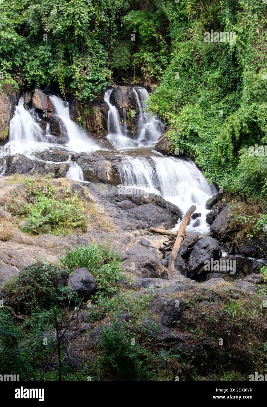 Fresh waterfall from the granite cliff in the rainforest of the ...