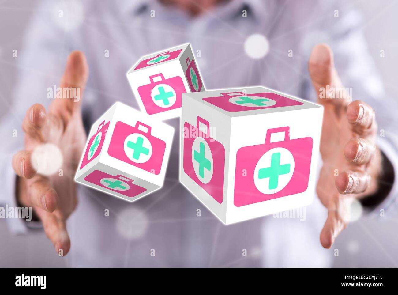 First aid concept between hands of a man in background Stock Photo - Alamy