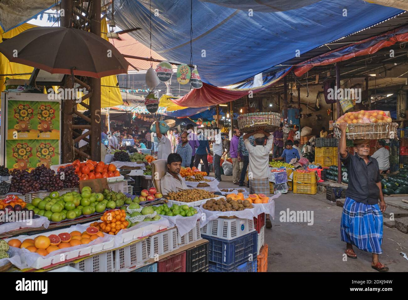 Market activity, shoppers & porters amidst fruit stalls in Crawford ...