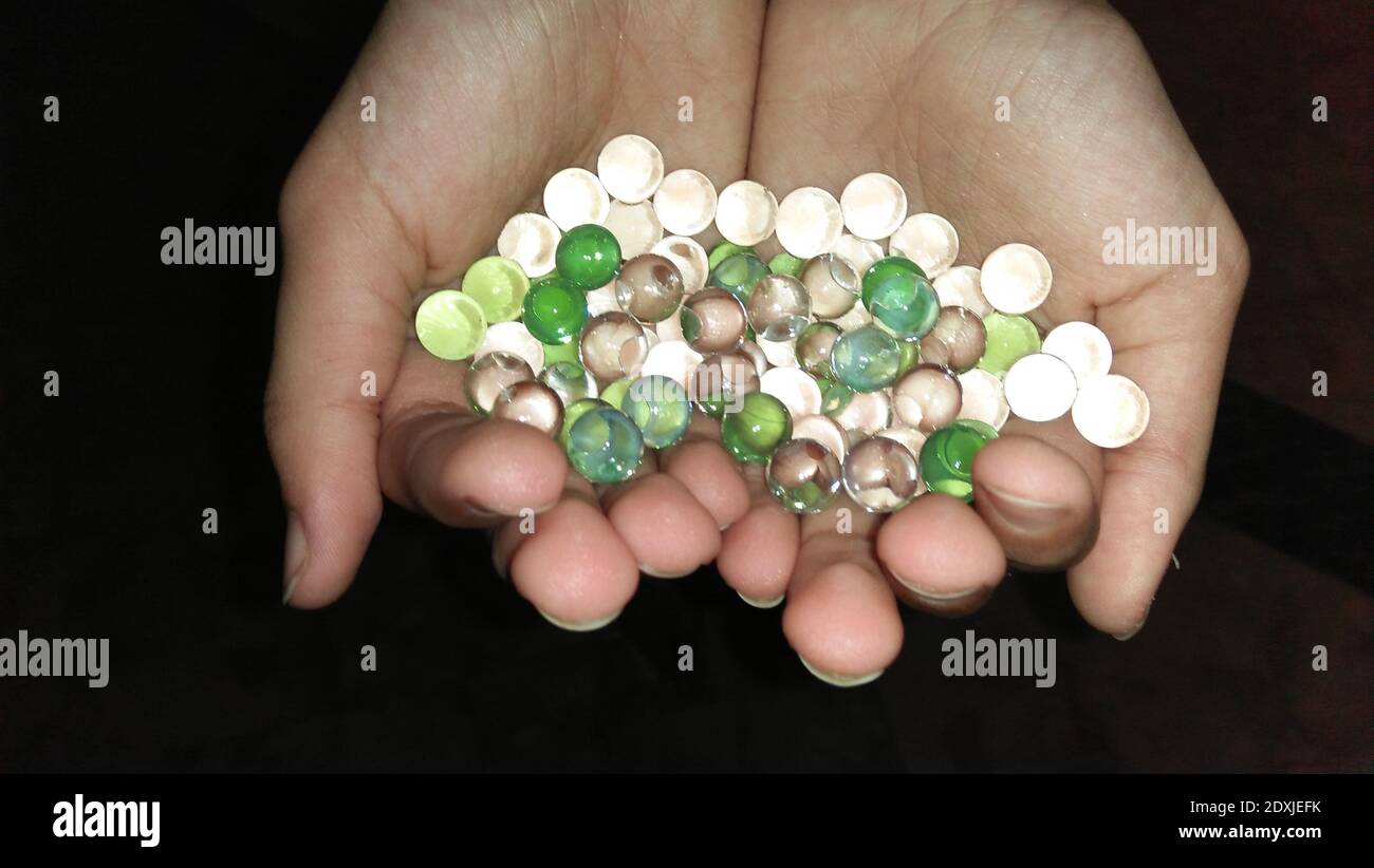 Holding Marbles High Resolution Stock Photography and Images - Alamy
