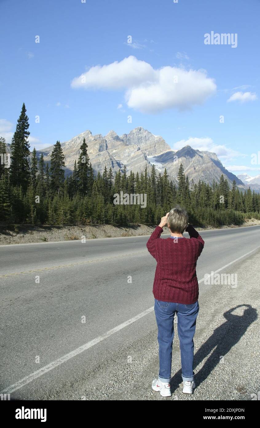 A back view of a female on Banff Canada Stock Photo - Alamy