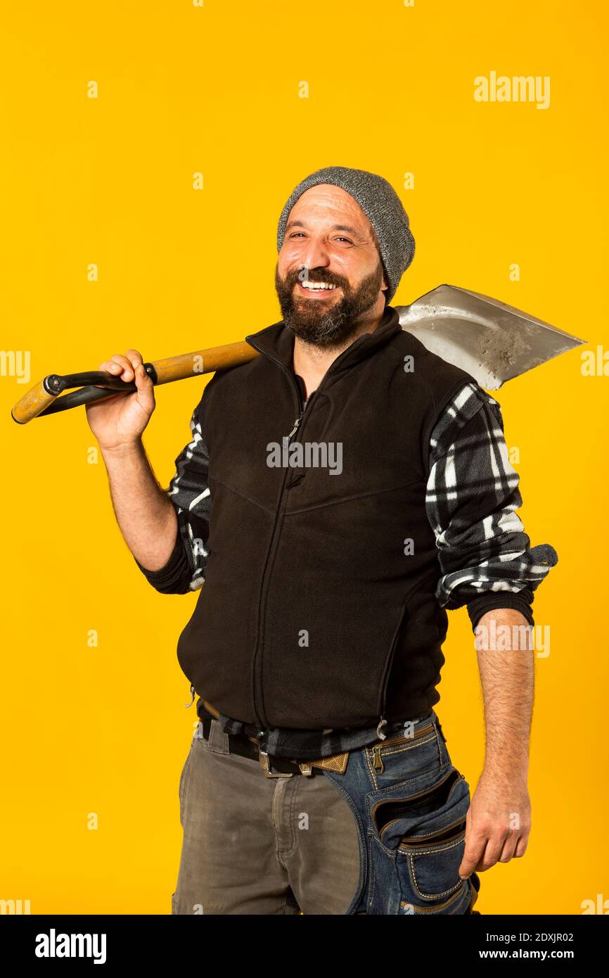 Man holding shovel hi-res stock photography and images - Alamy