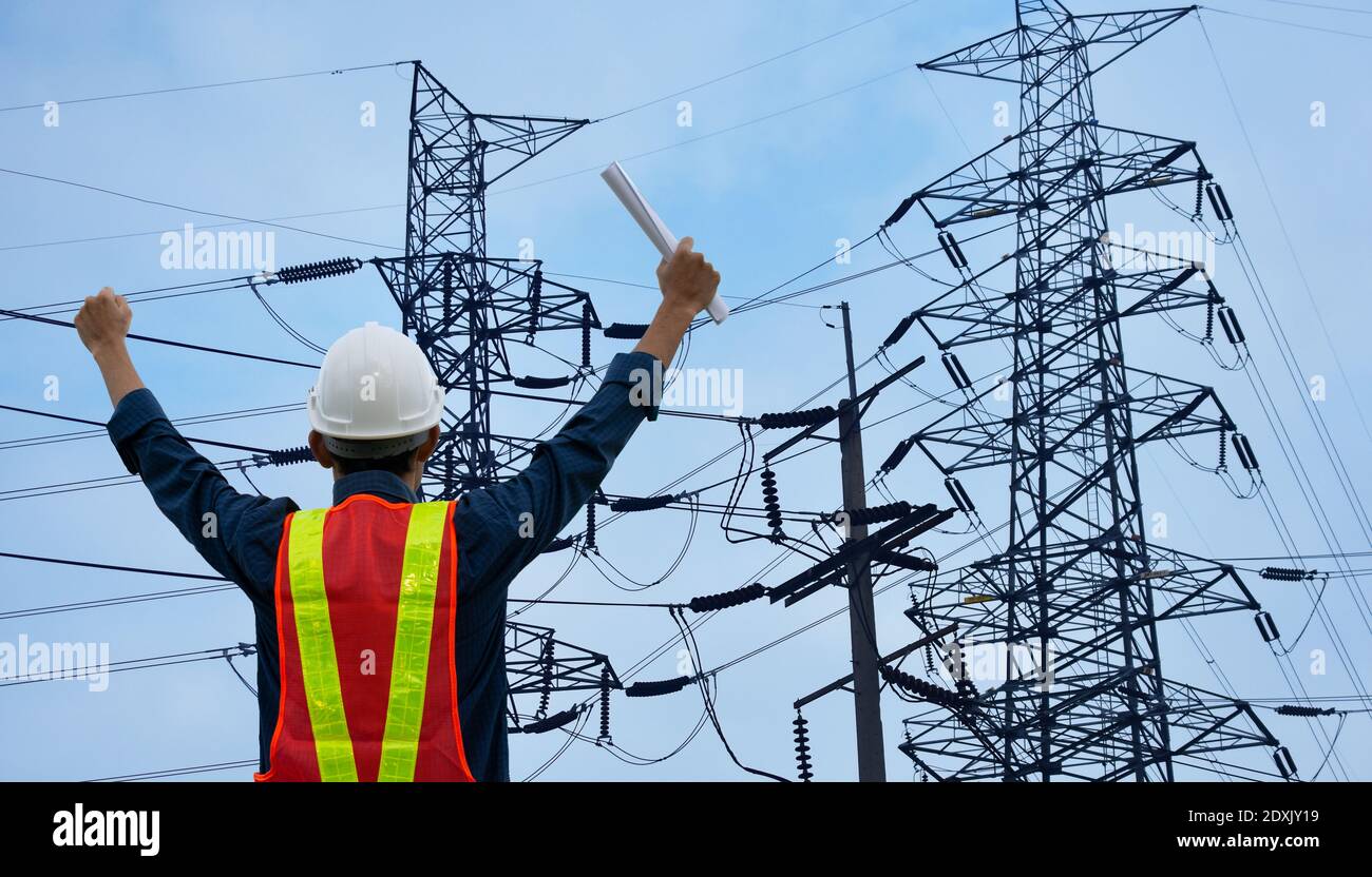 Engineer holding paper plan for work Stock Photo - Alamy