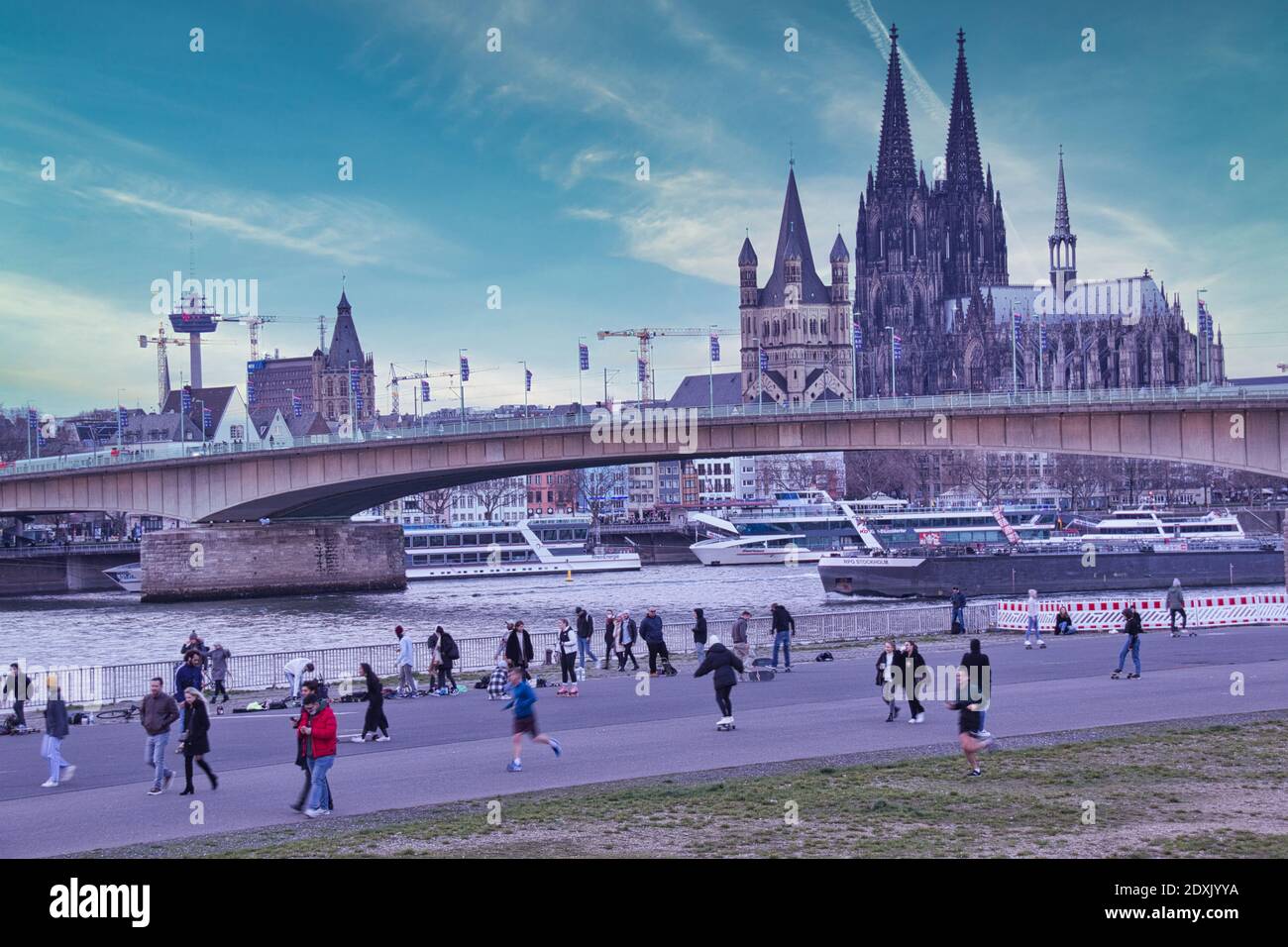 COLOGNE, GERMANY - Dec 19, 2020: People walk or play along the Rhine ...