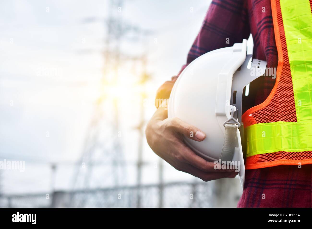 Close up hand holding white hard hat safety Engineer Technician Against ...