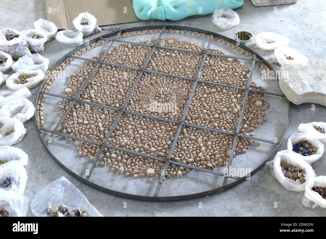 A setting mosaic tile pieces, artisanal pottery workshop Stock Photo ...