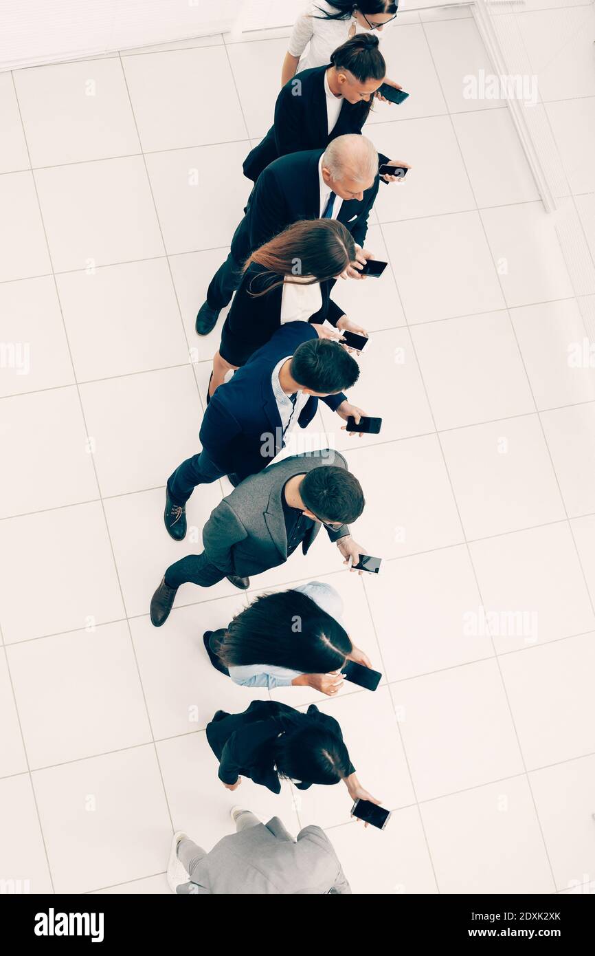 top view. diverse business of people standing in line for interviews ...