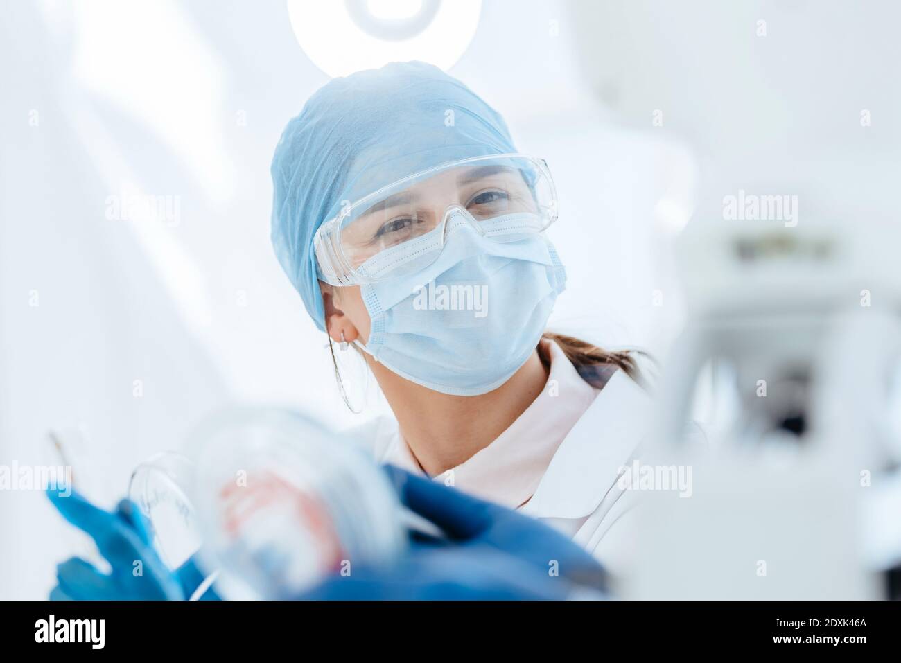 close up. female microbiologist discussing something with her colleague ...