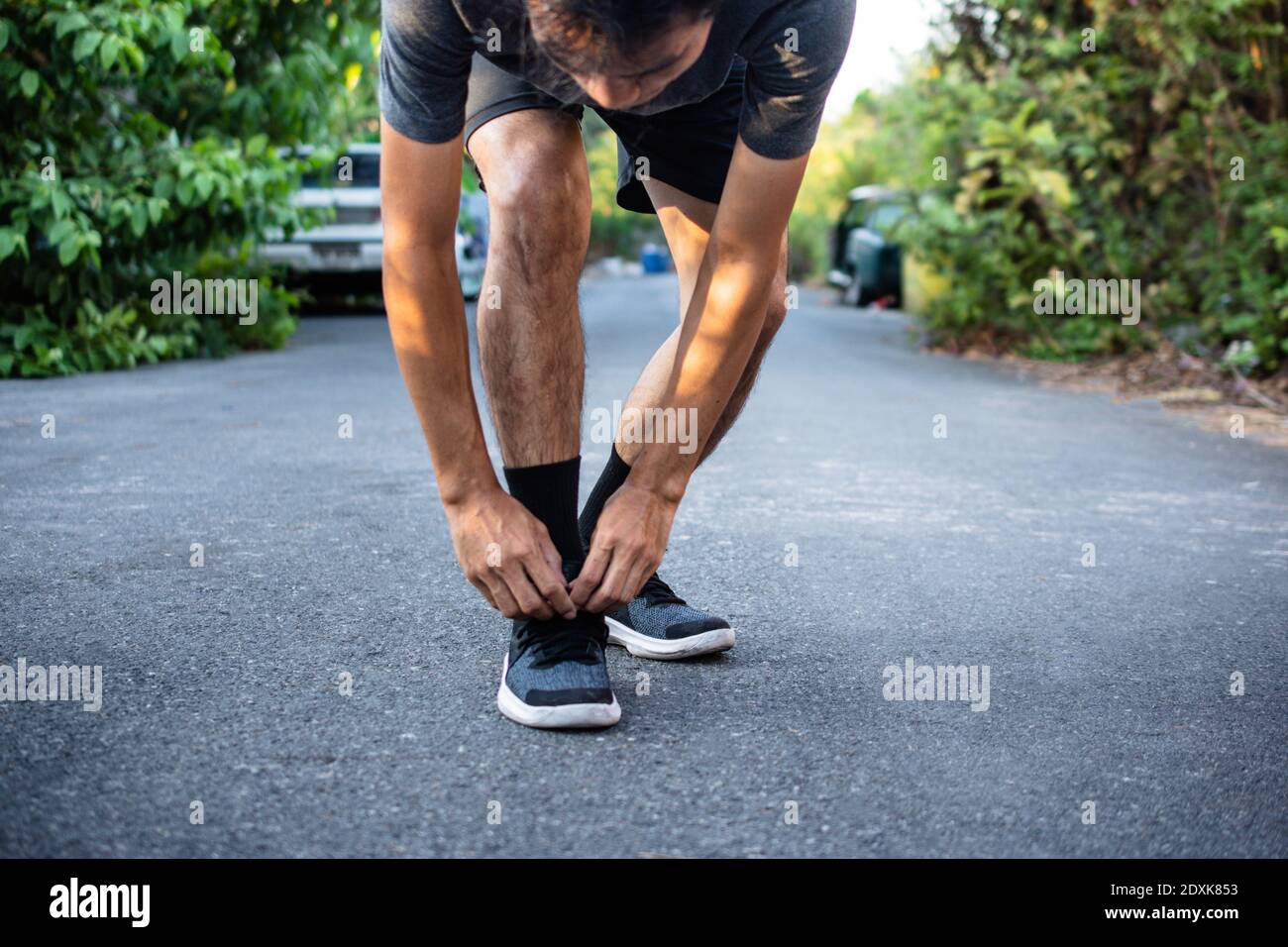 Sport man Running on road trying running shoes Stock Photo - Alamy