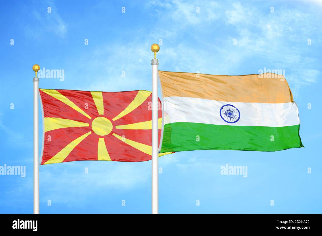 North Macedonia and India two flags on flagpoles and blue sky Stock ...