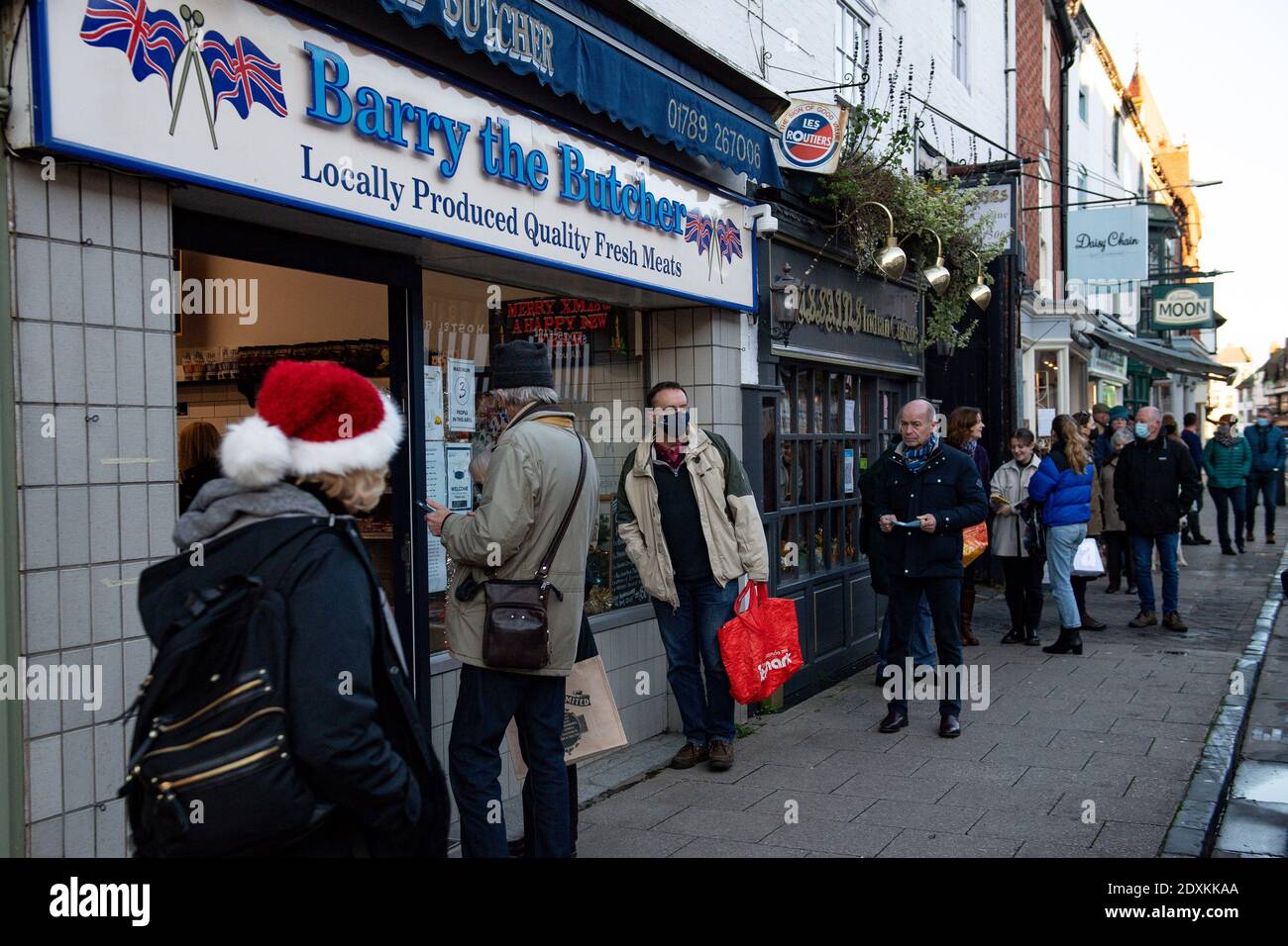 People queue outside Barry the Butcher in Stratford-upon-Avon on ...