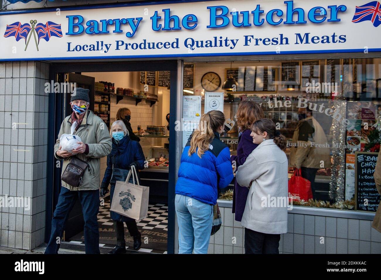 People queue outside Barry the Butcher in Stratford-upon-Avon on ...