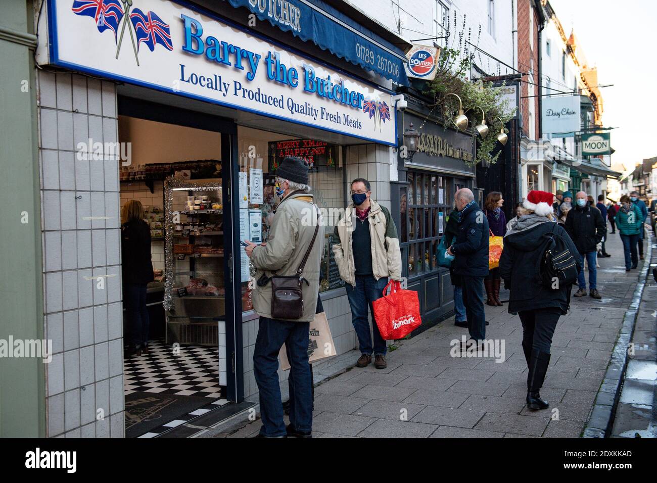 People queue outside Barry the Butcher in Stratford-upon-Avon on ...